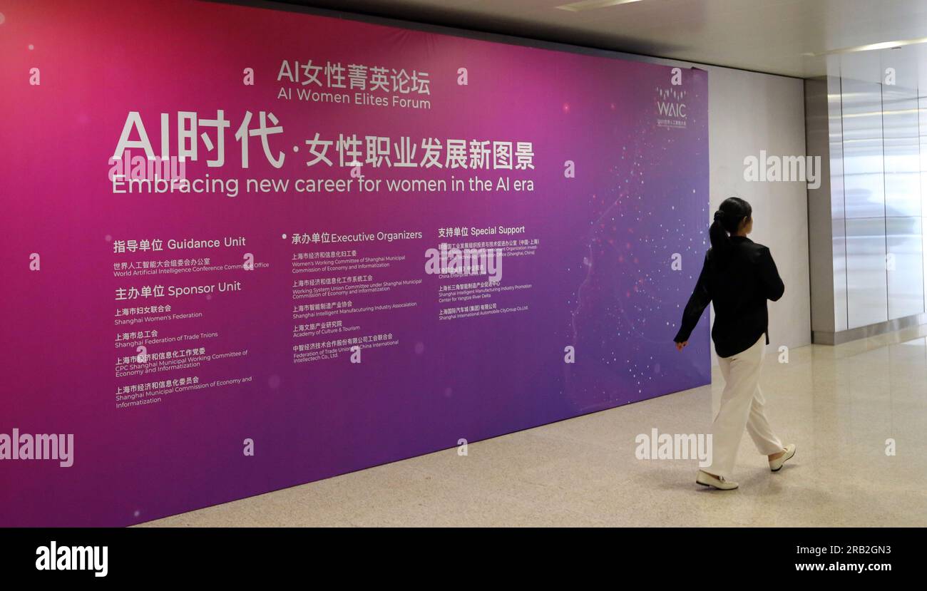 SHANGHAI, CHINA - JULY 6, 2023 - A visitor passes a poster of the Al ...
