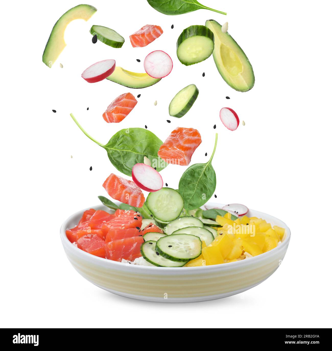 Poke recipe. Different ingredients falling into bowl on white ...