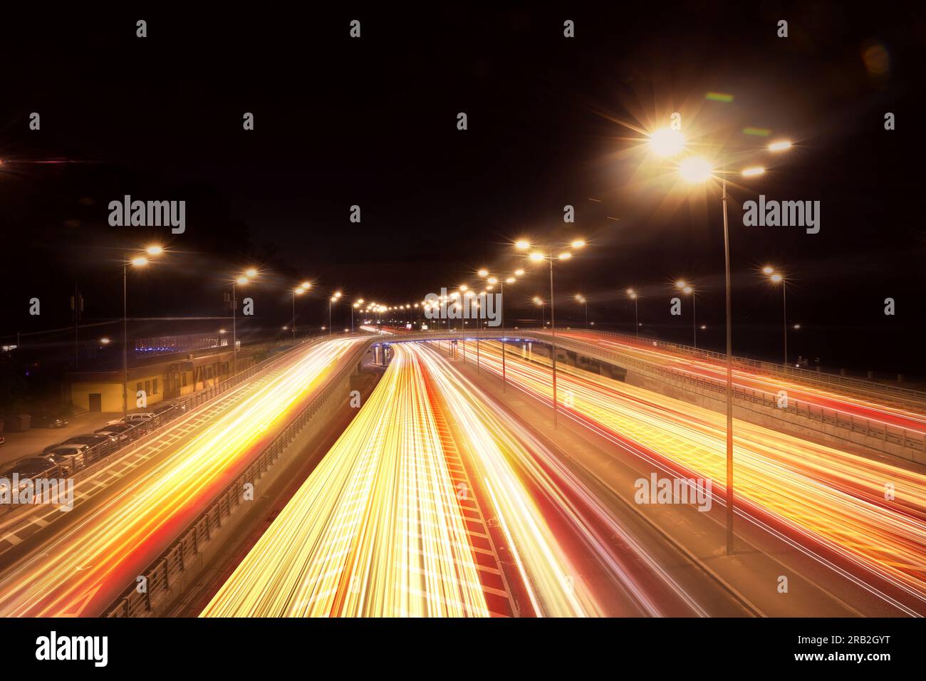 Road traffic, motion blur effect. View of car light trails at night ...