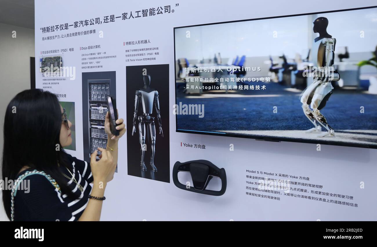 SHANGHAI, CHINA - JULY 6, 2023 - Visitors view the Tesla Bot humanoid ...