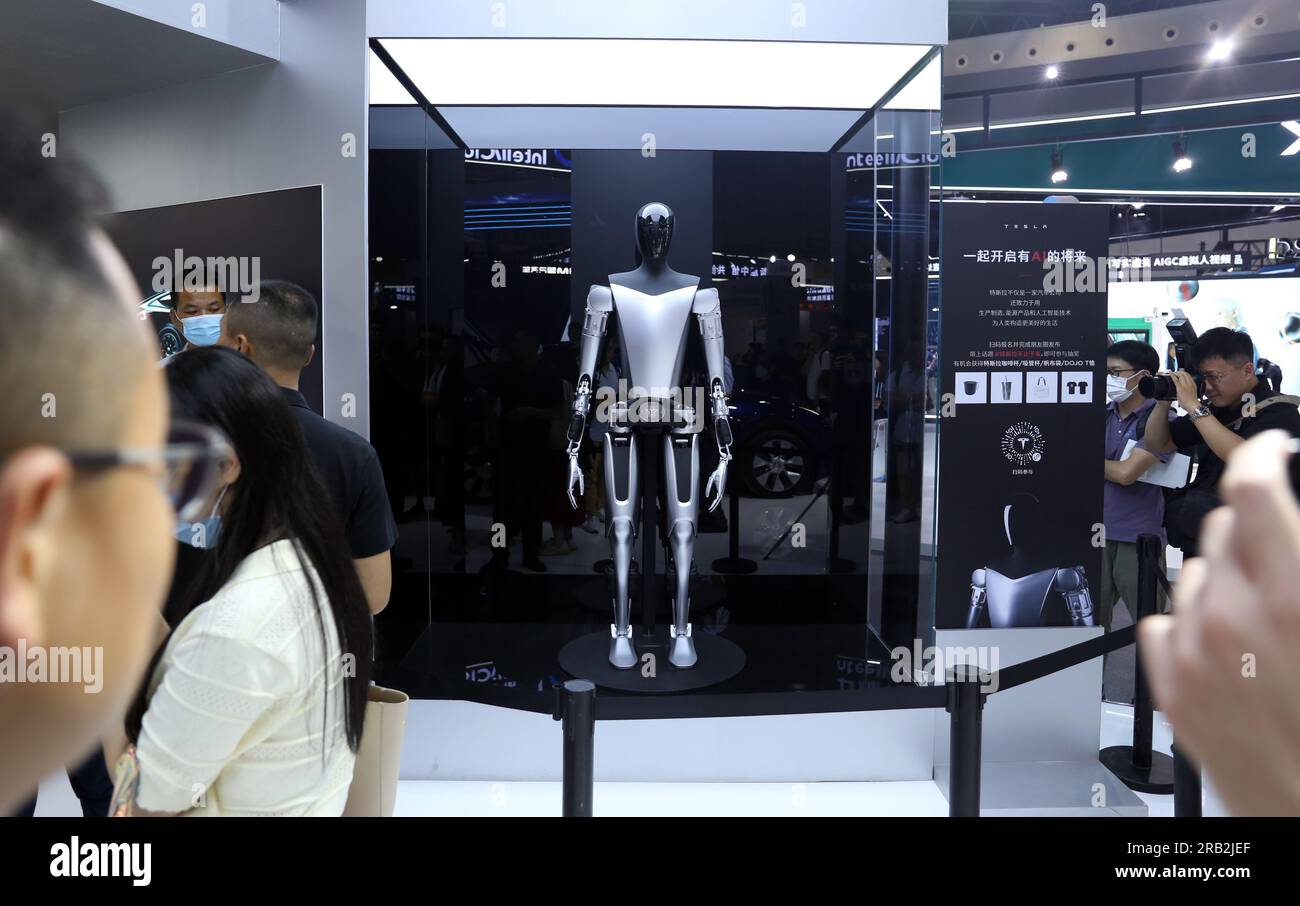 SHANGHAI, CHINA - JULY 6, 2023 - Visitors view the Tesla Bot humanoid ...