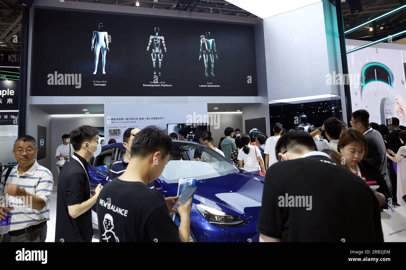 SHANGHAI, CHINA - JULY 6, 2023 - Visitors view the Tesla Bot humanoid ...