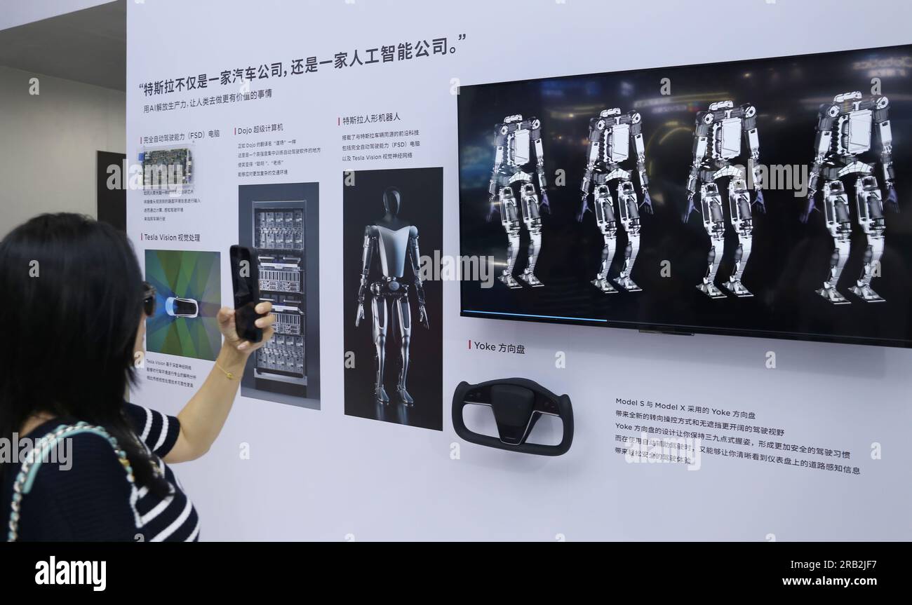 SHANGHAI, CHINA - JULY 6, 2023 - Visitors view the Tesla Bot humanoid ...