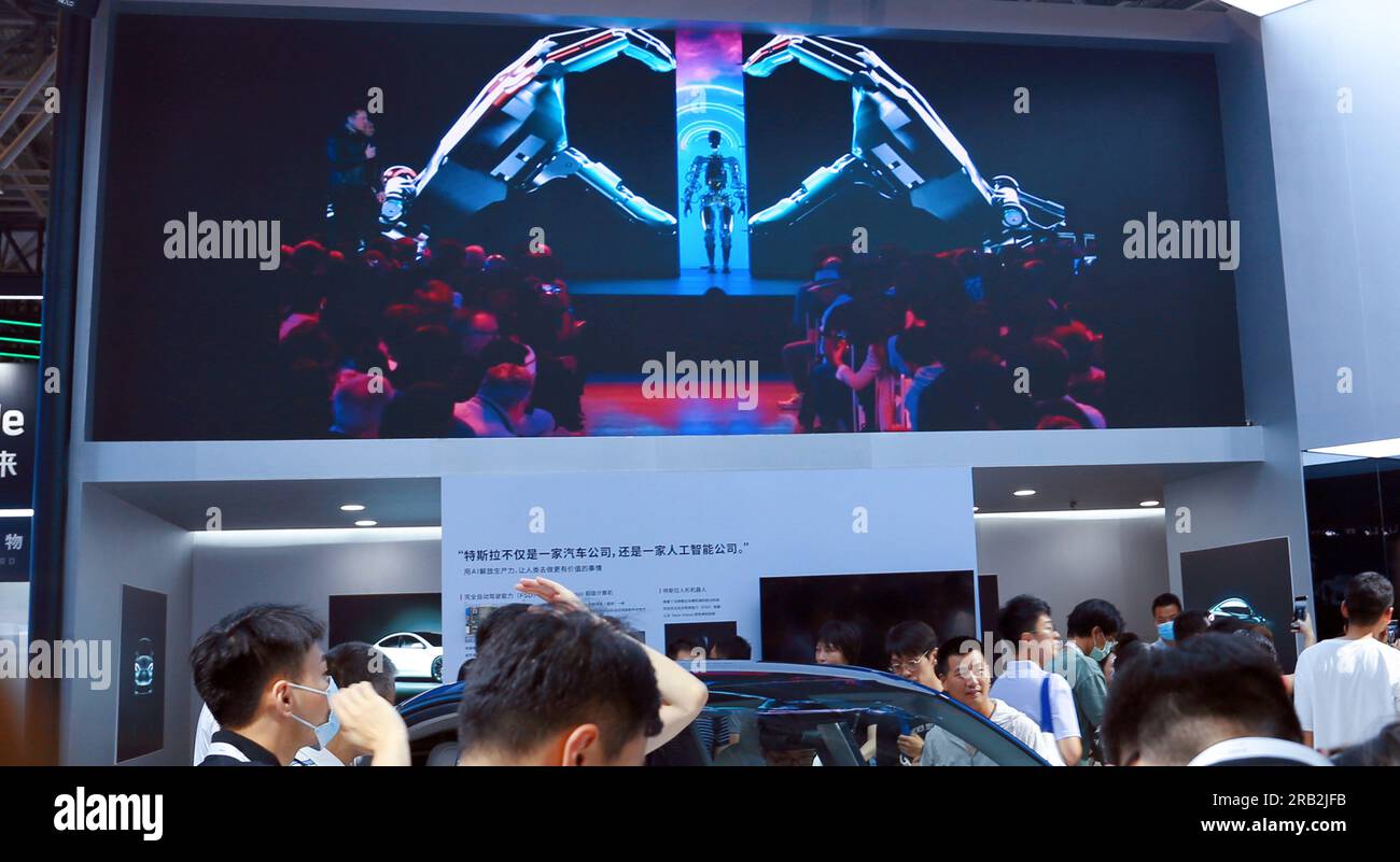 SHANGHAI, CHINA - JULY 6, 2023 - Visitors view the Tesla Bot humanoid ...
