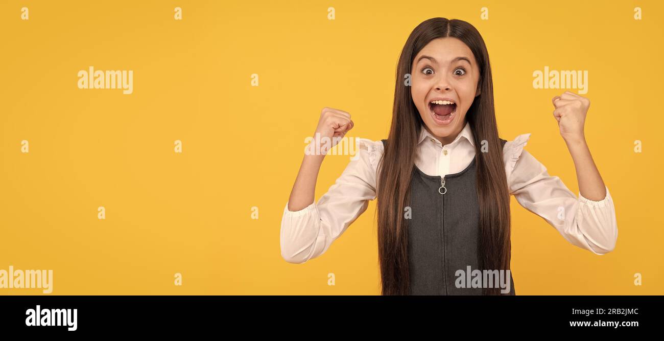 Happy teenage girl winner give winning gesture celebrating victory ...