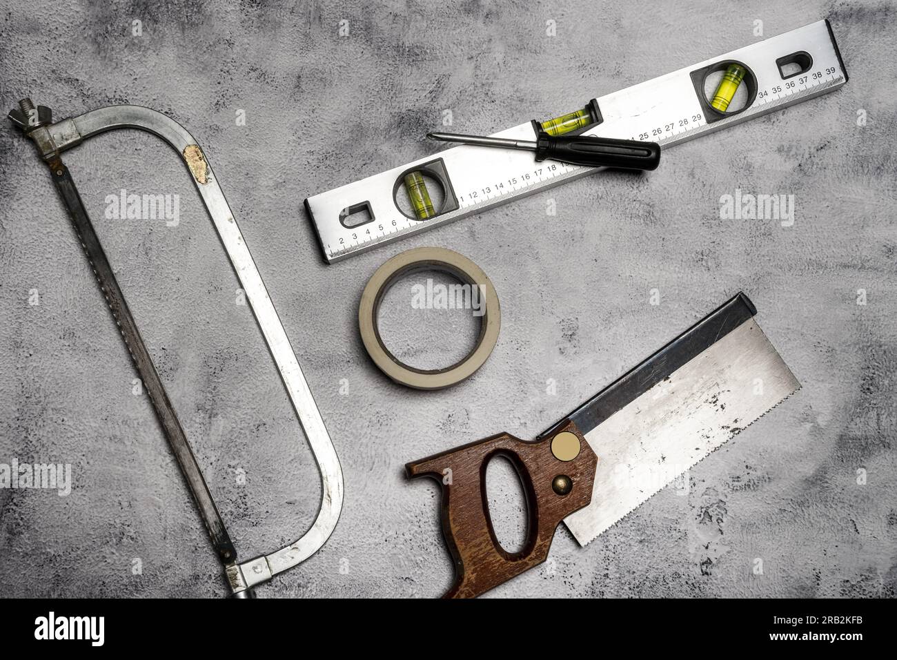 Tools used to tinker at home with a level and different saws Stock ...