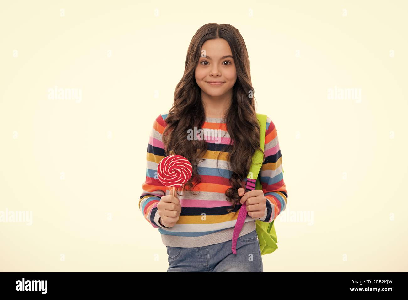 Cool teen child with lollipop over white isolated background. Sweet ...