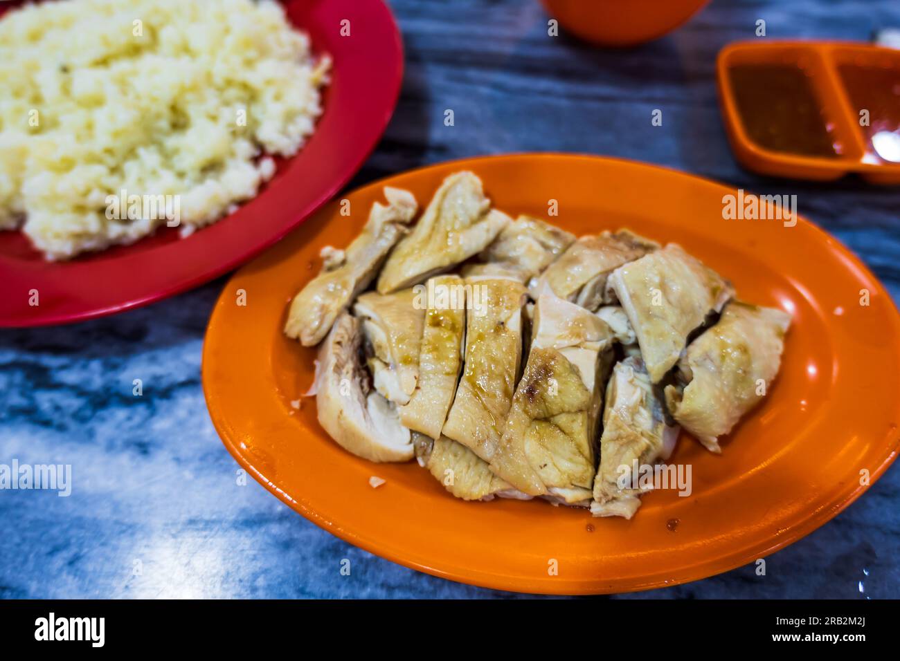 Hainanese steamed chicken rice at hawker stall, a famous dish in ...