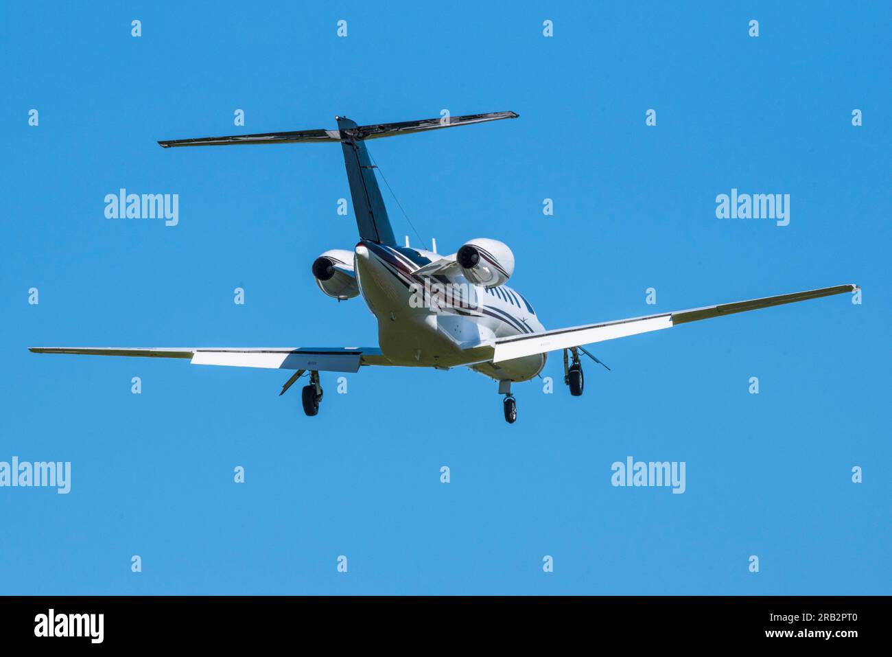 Sharp, close-up telephoto of a private jet aircraft in flight, Victoria ...