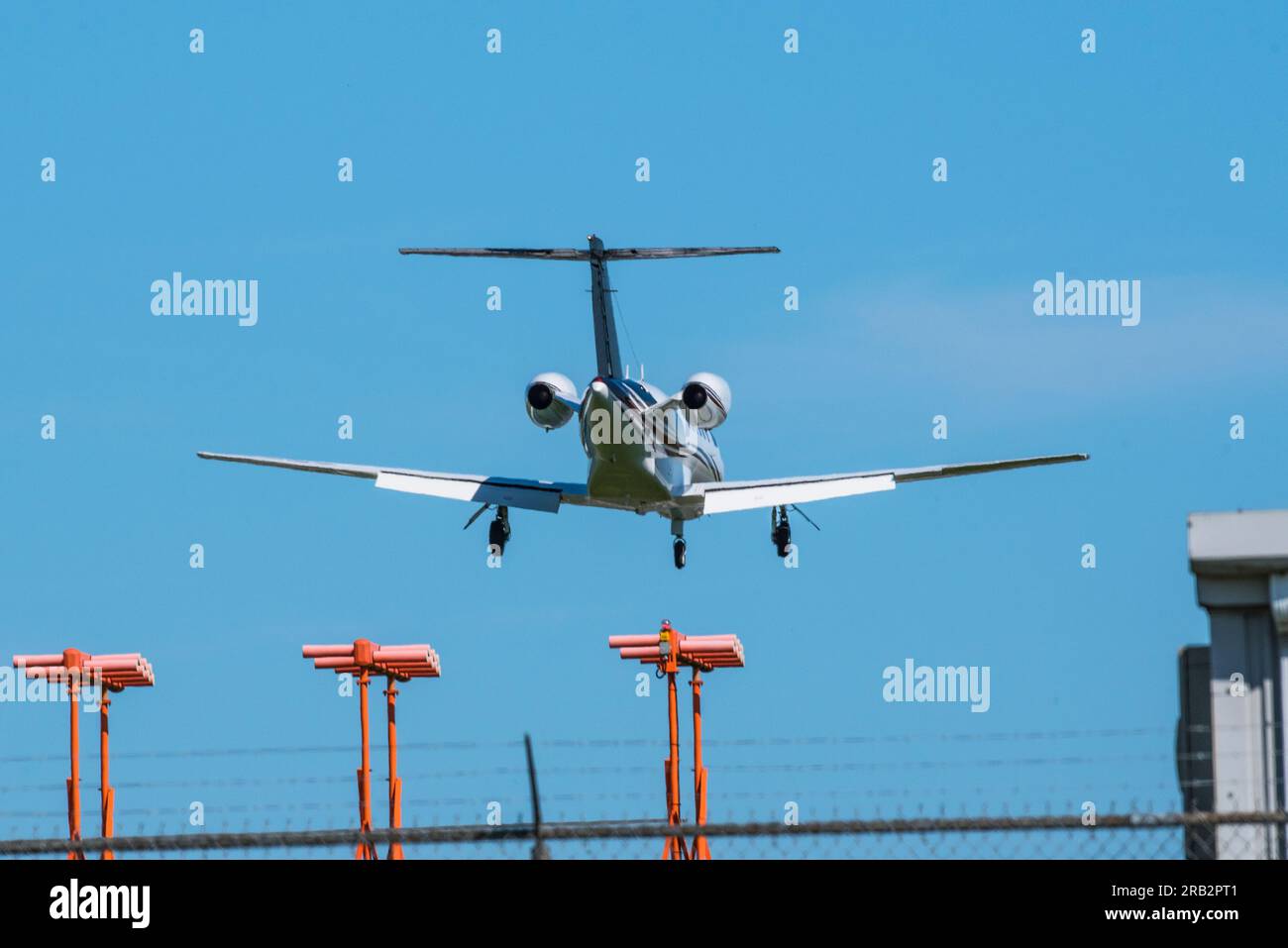 Sharp, close-up telephoto of a private jet aircraft in flight, Victoria ...