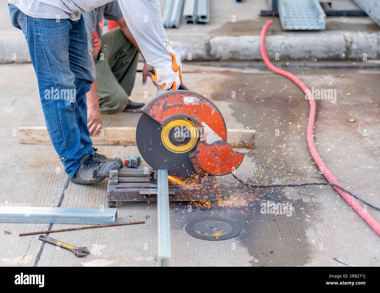 Worker cutting steel with fiber machine for use factory roof structure ...