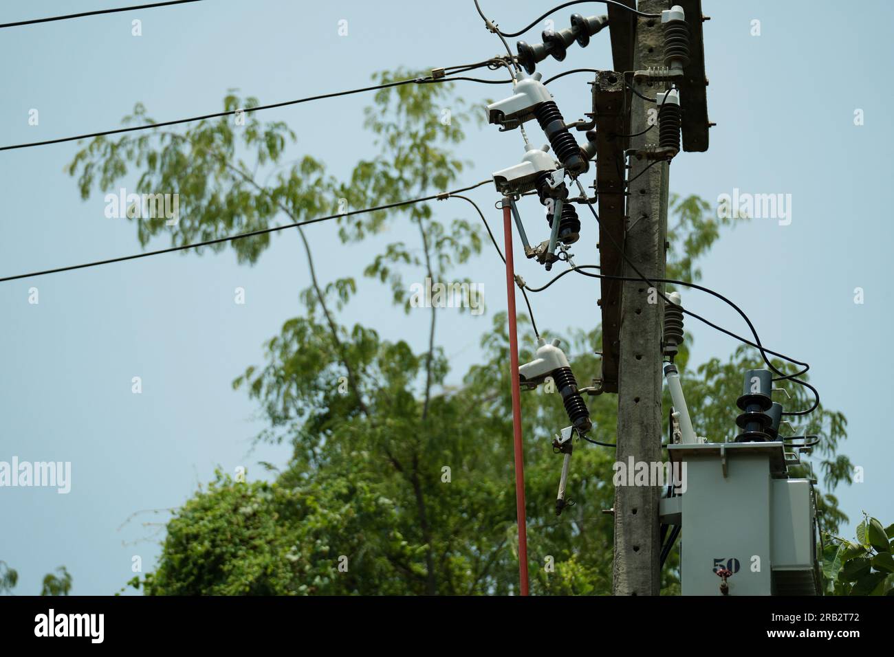 electrician using a clamp stick to repair dropping fuse cutout on ...