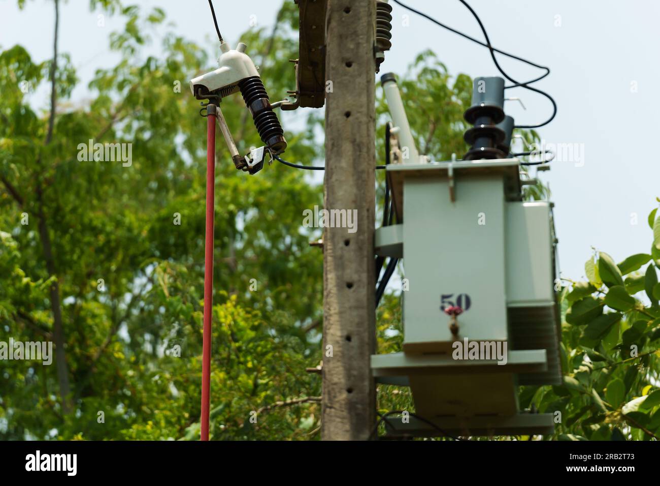 electrician using a clamp stick to repair dropping fuse cutout on ...
