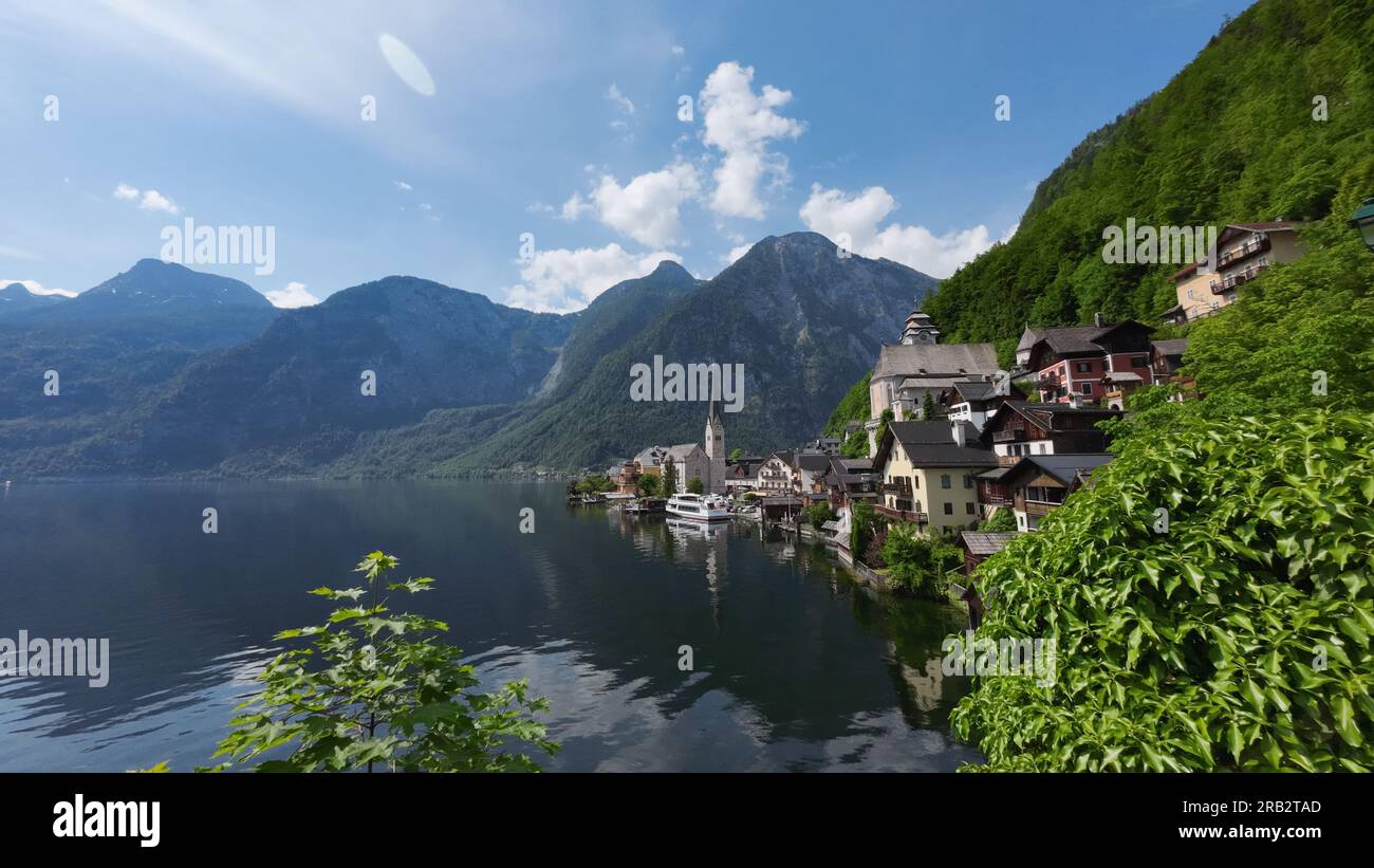 The peaceful village of Hallstatt on the shores of Hallstatt lake, with ...