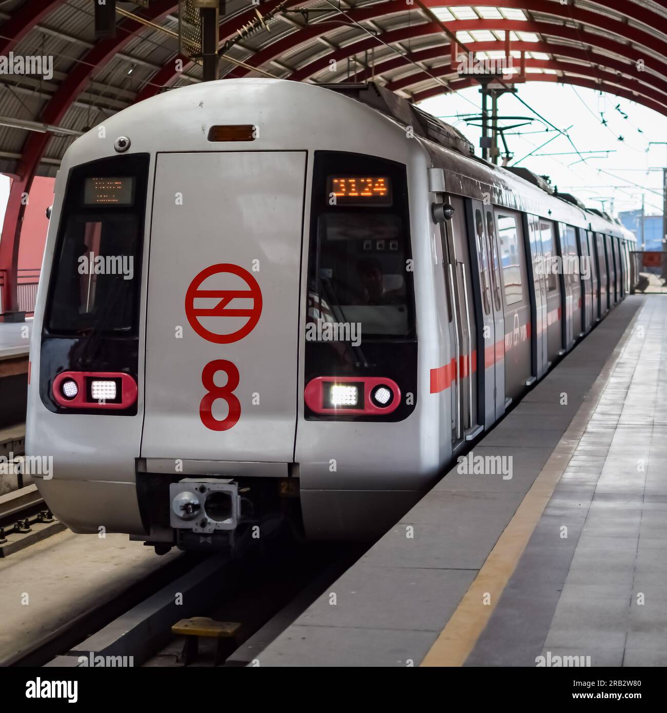 Delhi Metro train arriving at Jhandewalan metro station in New Delhi ...