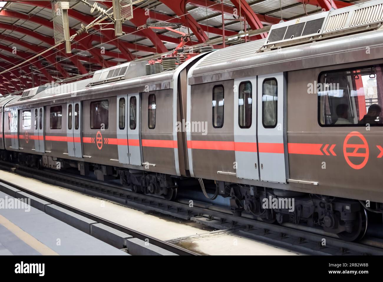 Delhi Metro train arriving at Jhandewalan metro station in New Delhi ...