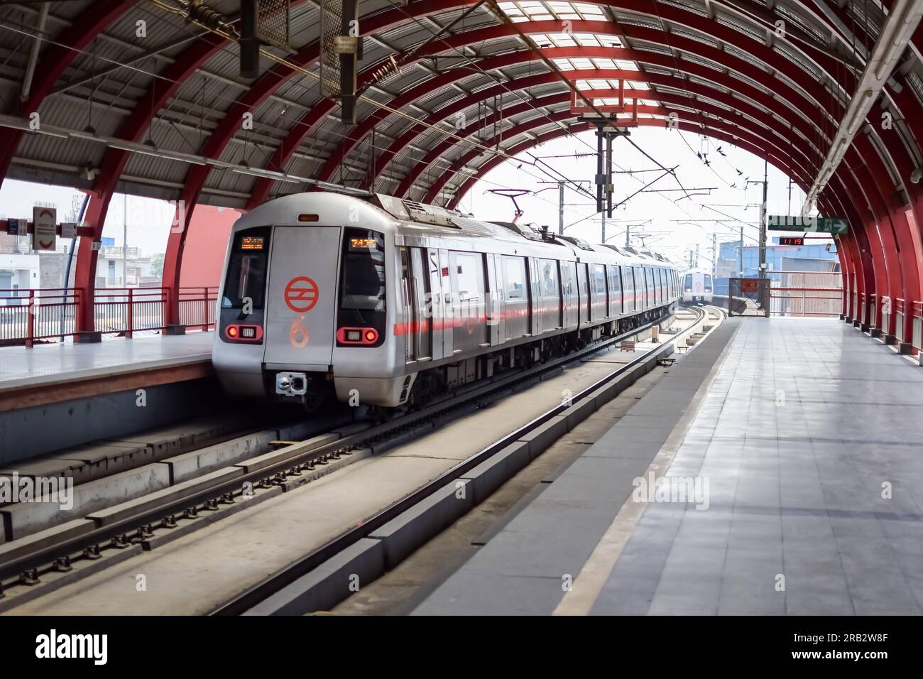 Delhi Metro train arriving at Jhandewalan metro station in New Delhi ...