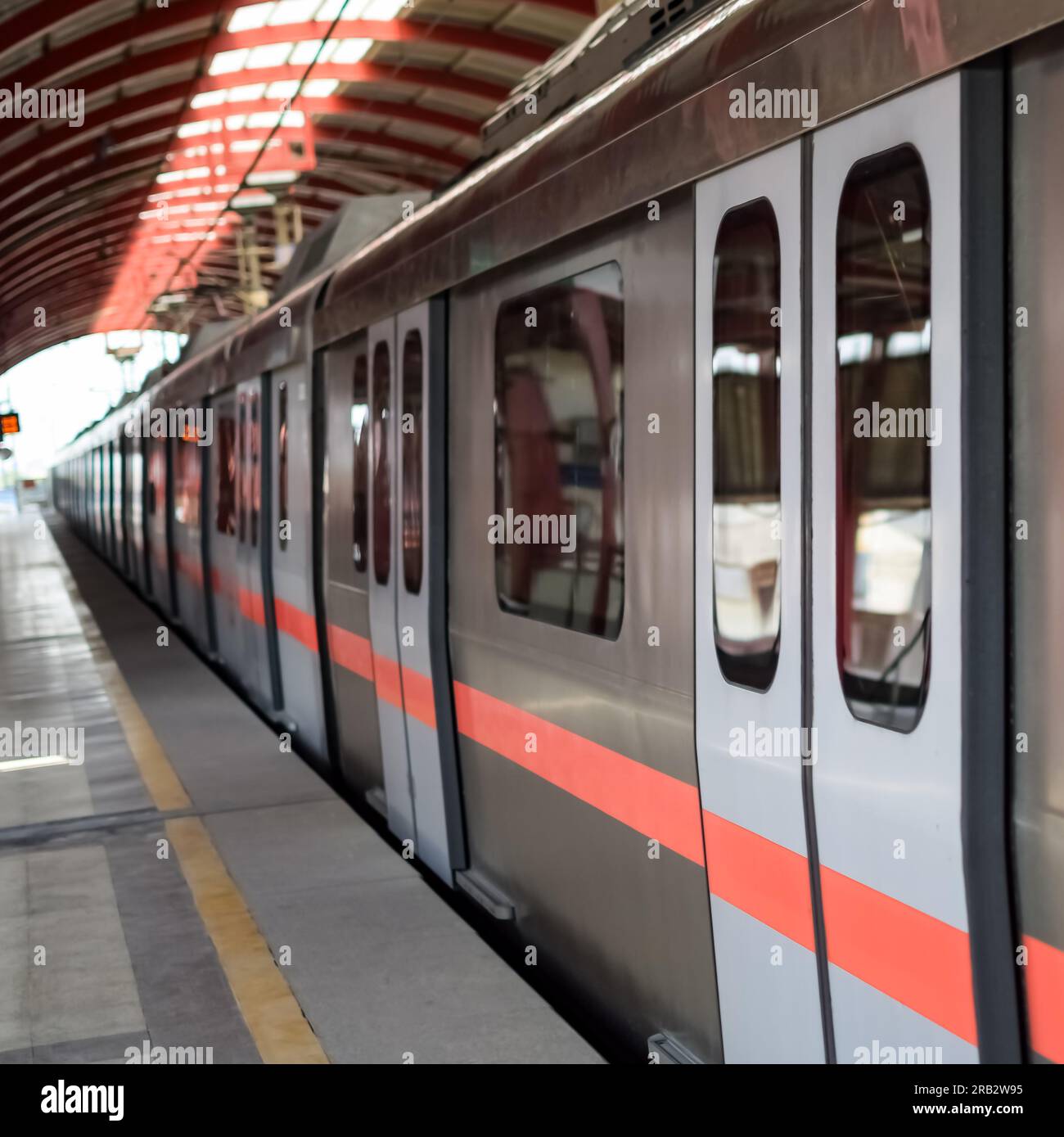 Delhi Metro train arriving at Jhandewalan metro station in New Delhi ...