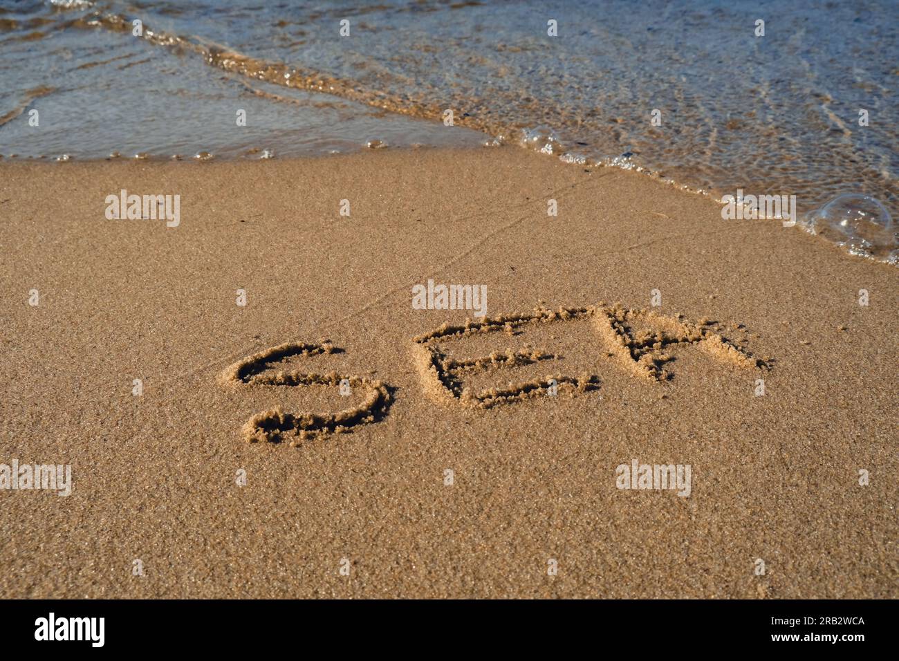 Water washing away word hi-res stock photography and images - Alamy
