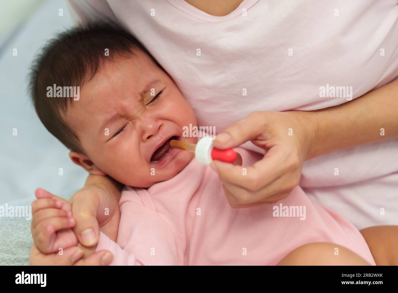Baby cry medicine hi-res stock photography and images - Alamy