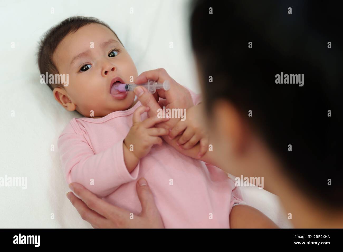 Baby medication mouth syringe hi-res stock photography and images - Alamy