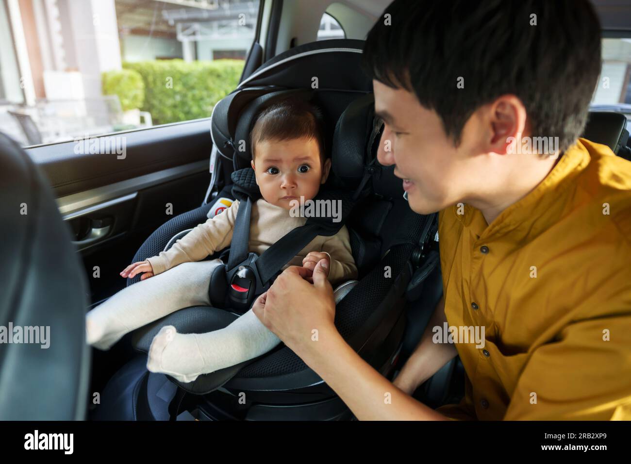 Parent with baby in carseat hi-res stock photography and images - Alamy