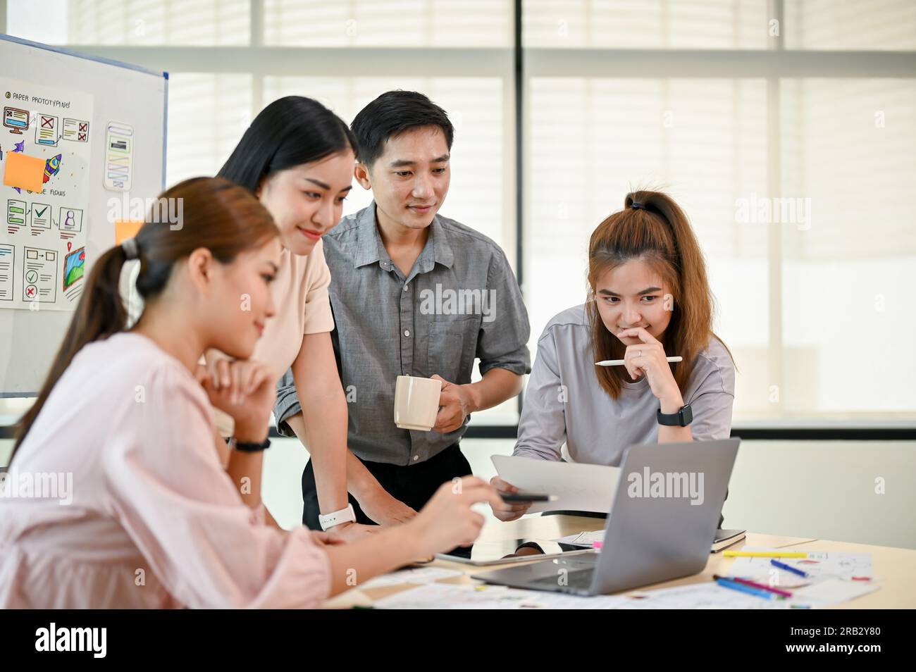 A tech developer team is in the meeting, planning and brainstorming on ...