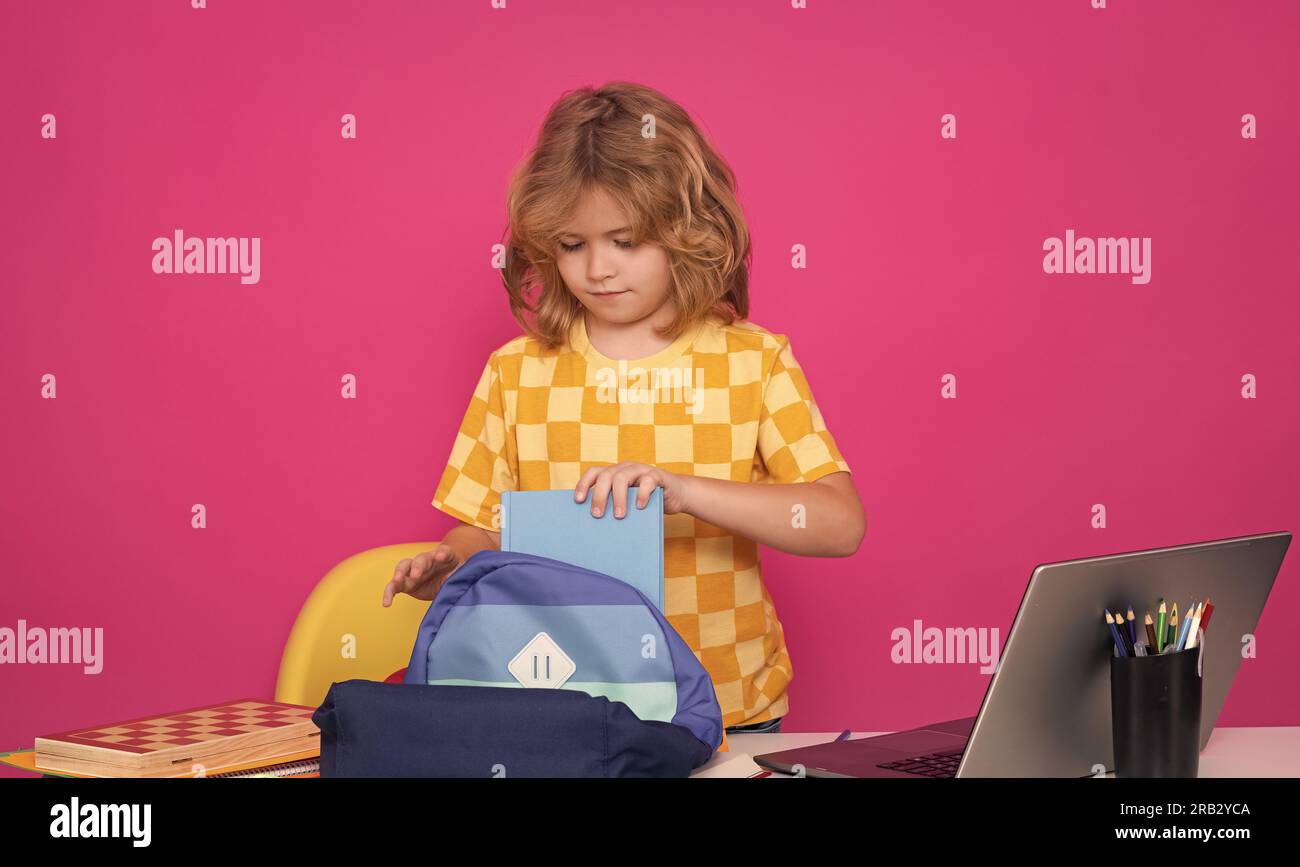 Kid boy from elementary school with book. Smart caucasian school boy ...