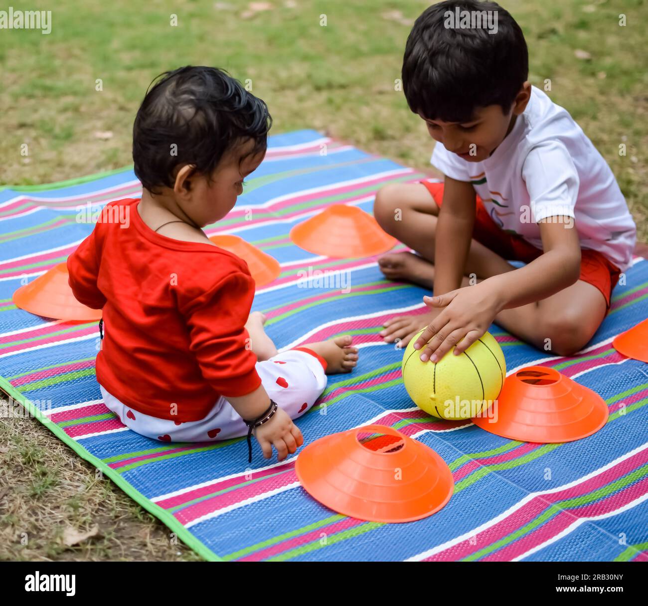 Two happy boys in society park, happy Asian brothers who are smiling ...