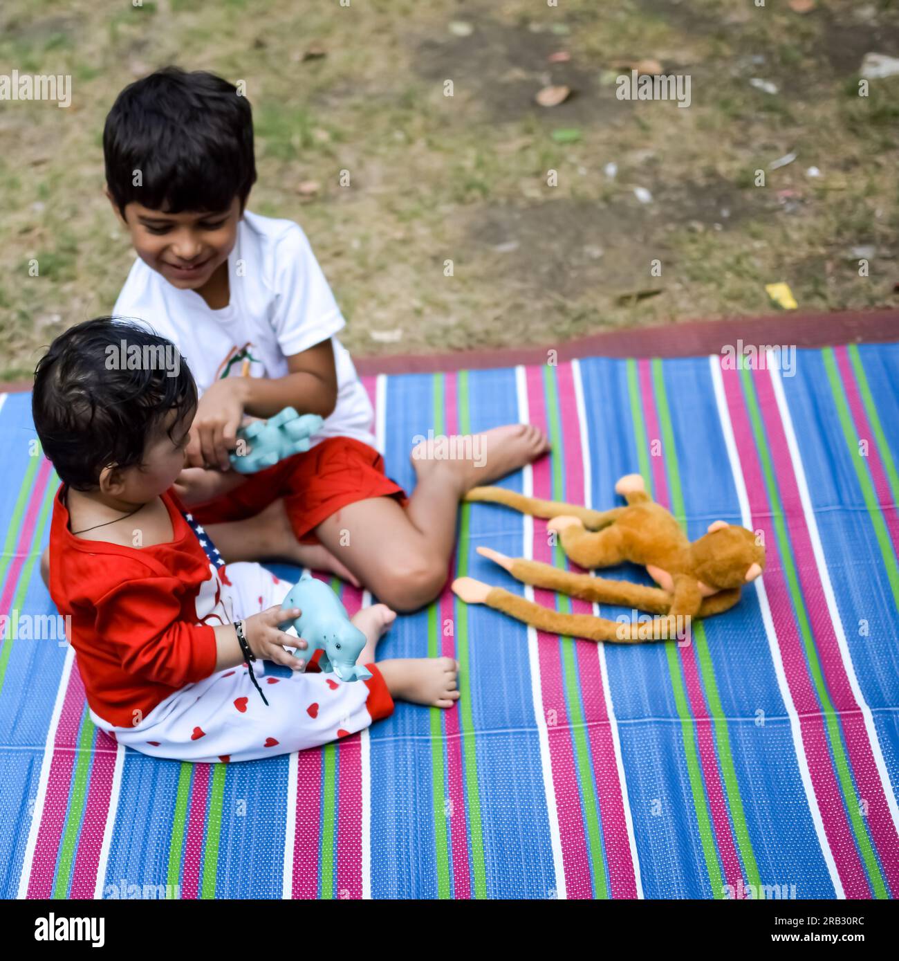 Two happy boys in society park, happy Asian brothers who are smiling ...