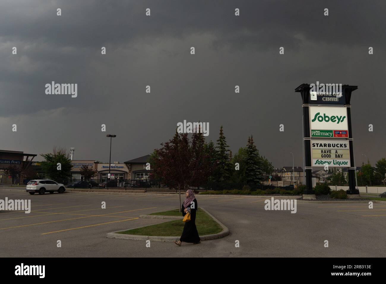 Calgary, Alberta, Canada. 6th July, 2023. A woman walks through a ...