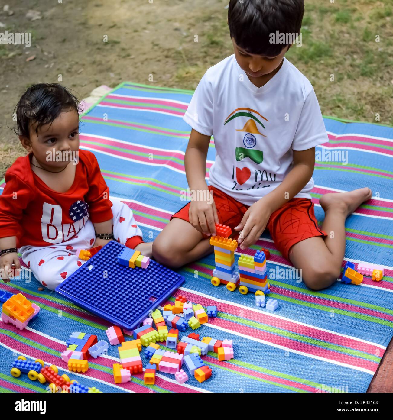 Two happy boys in society park, happy Asian brothers who are smiling ...