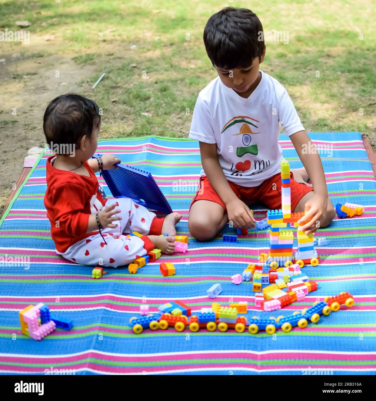 Two happy boys in society park, happy Asian brothers who are smiling ...