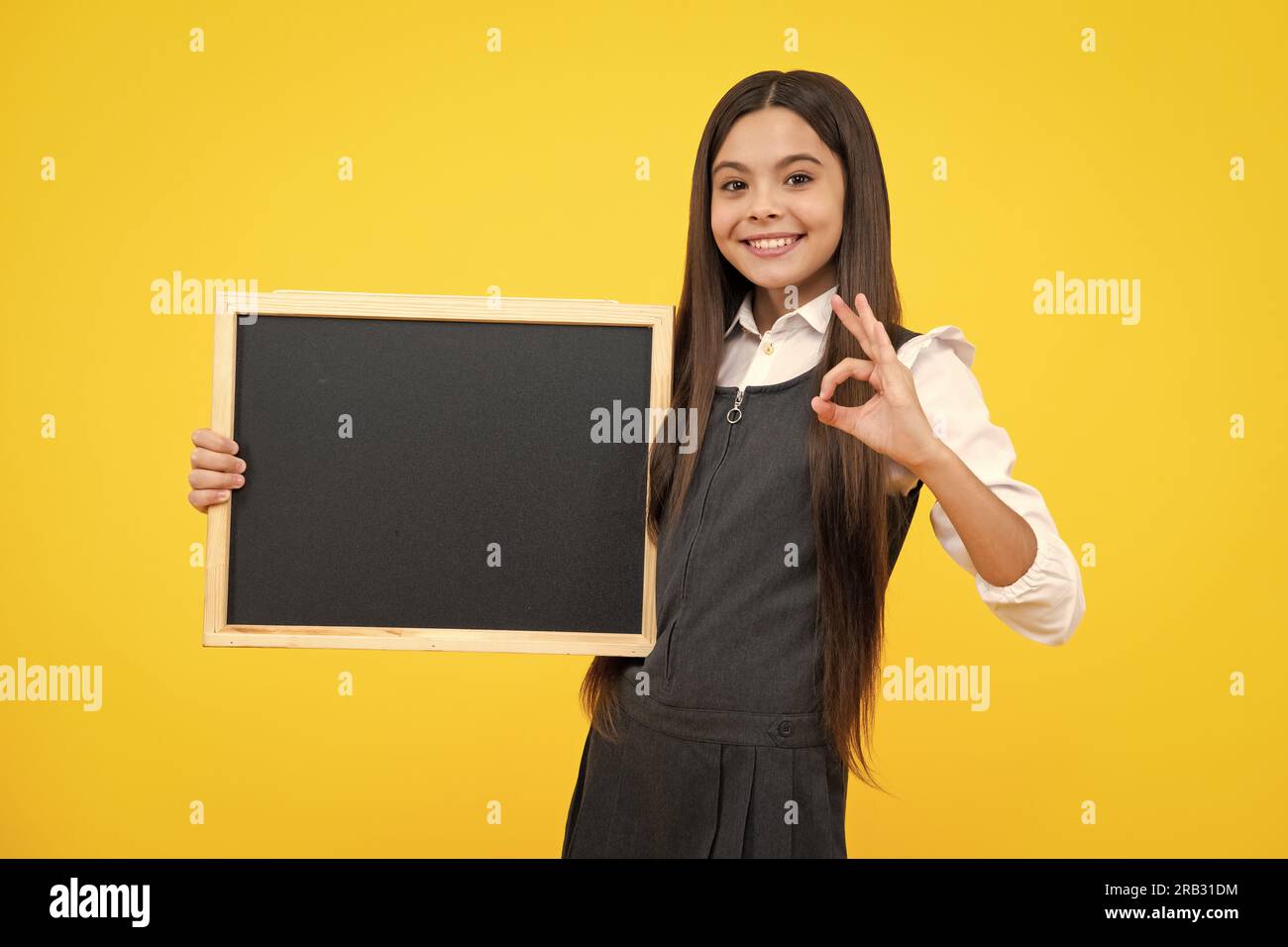 School sales board. Cheerful teenage girl kid hold blackboard ...