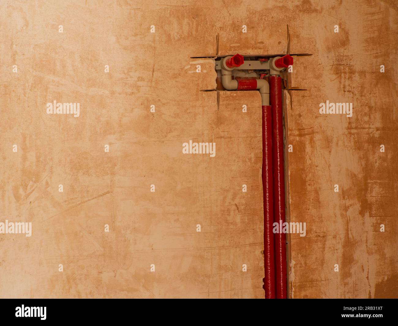 Installing heating and water pipes in apartment Stock Photo - Alamy