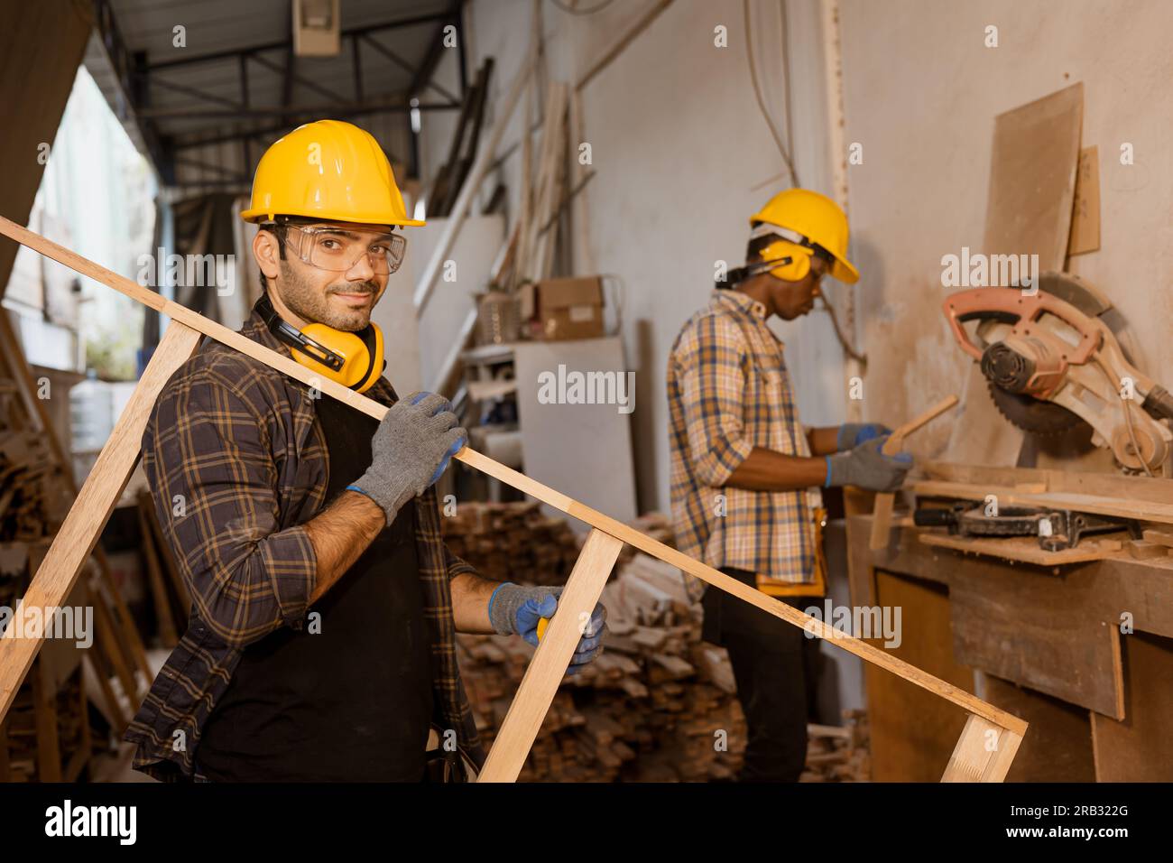 Happy worker working together in wood furniture factory, staff employee ...
