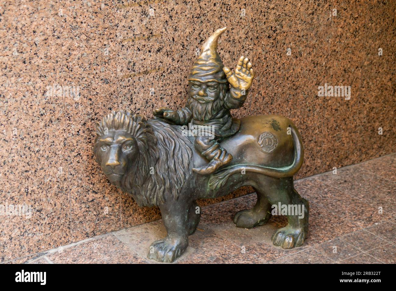 Dwarf riding a lion sleeping cap sitting on a lion and waving hello ...