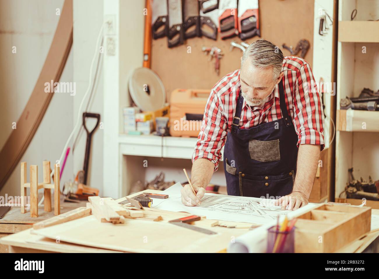 Senior professional engineer architect male working design drawing ...