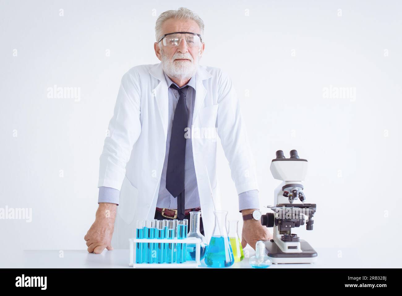 Portrait Doctor senior elderly scientist chemist standing in chemical science lap with ...