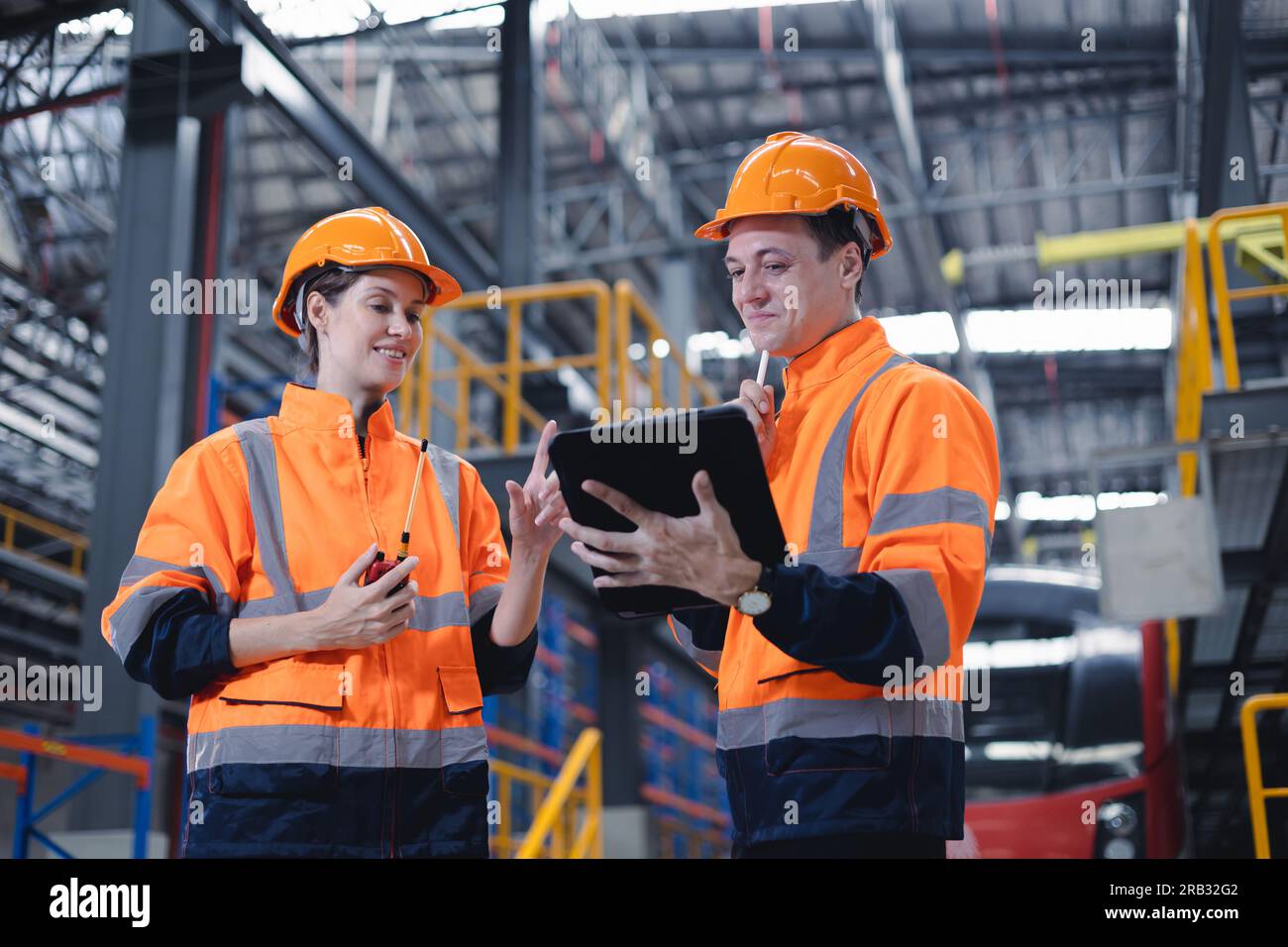 Engineer man and women worker working team together in electric train ...