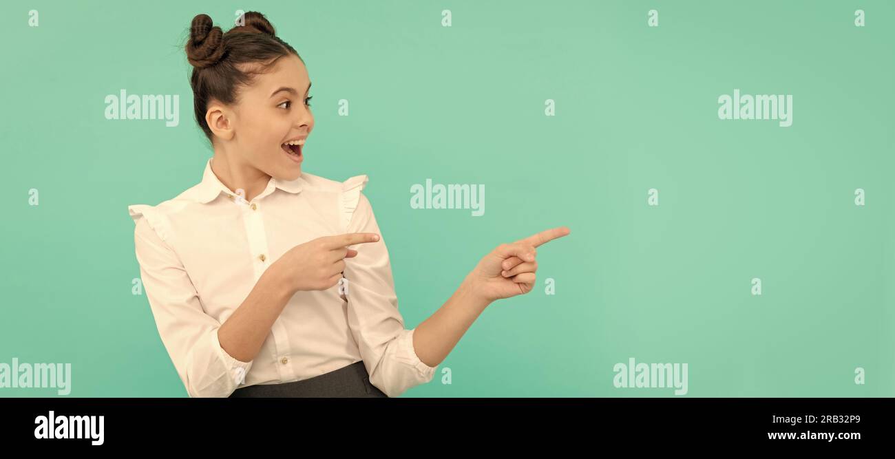 Exclusive. Happy schoolchild point fingers. Pointing gesture. Pointing ...