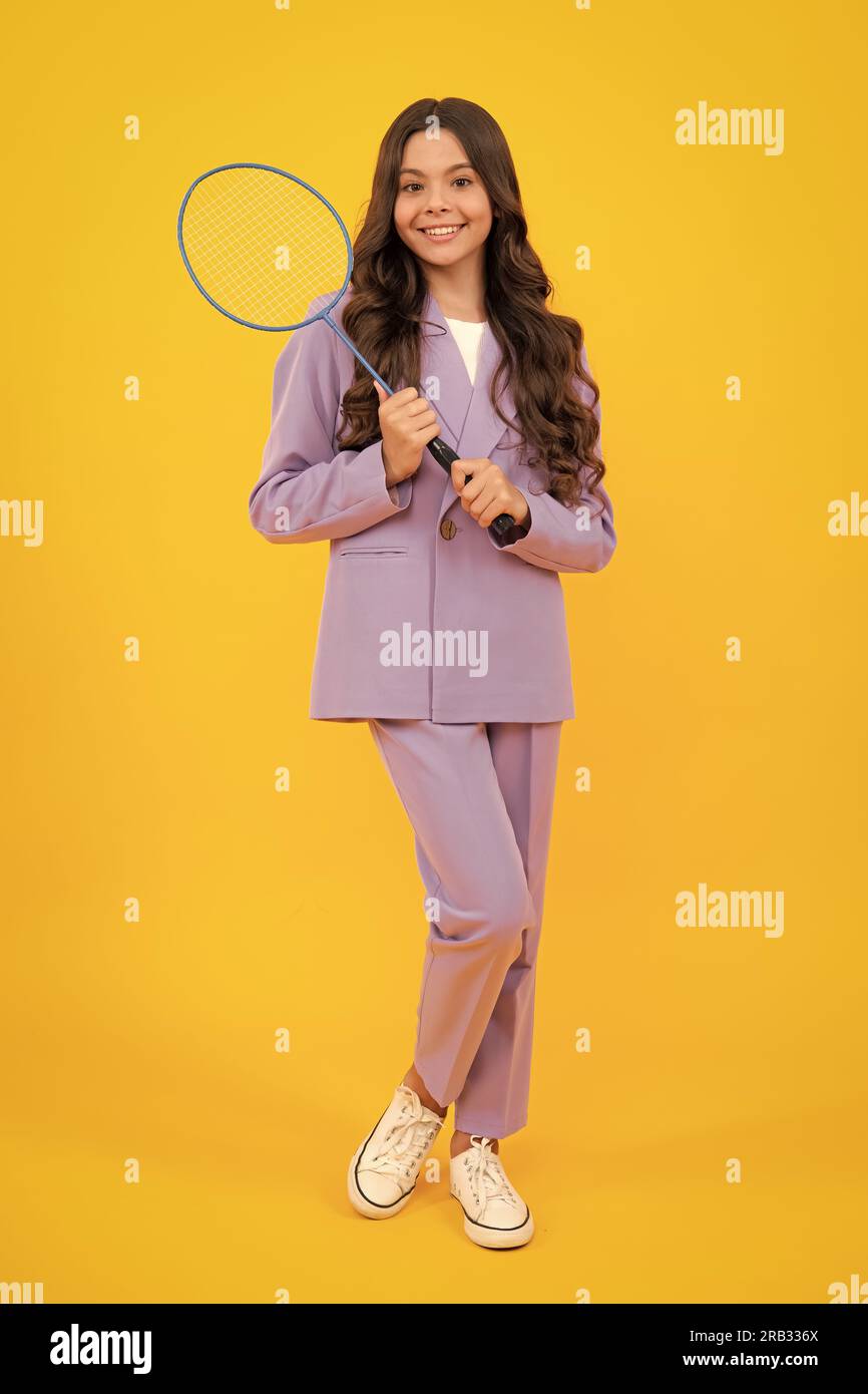 Teen girl badminton player in suit with badminton racket isolated on ...