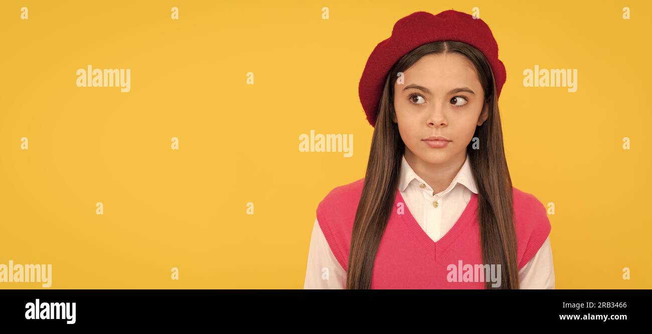 kid looking away. serious kid in beret. child has long hair. skin ...
