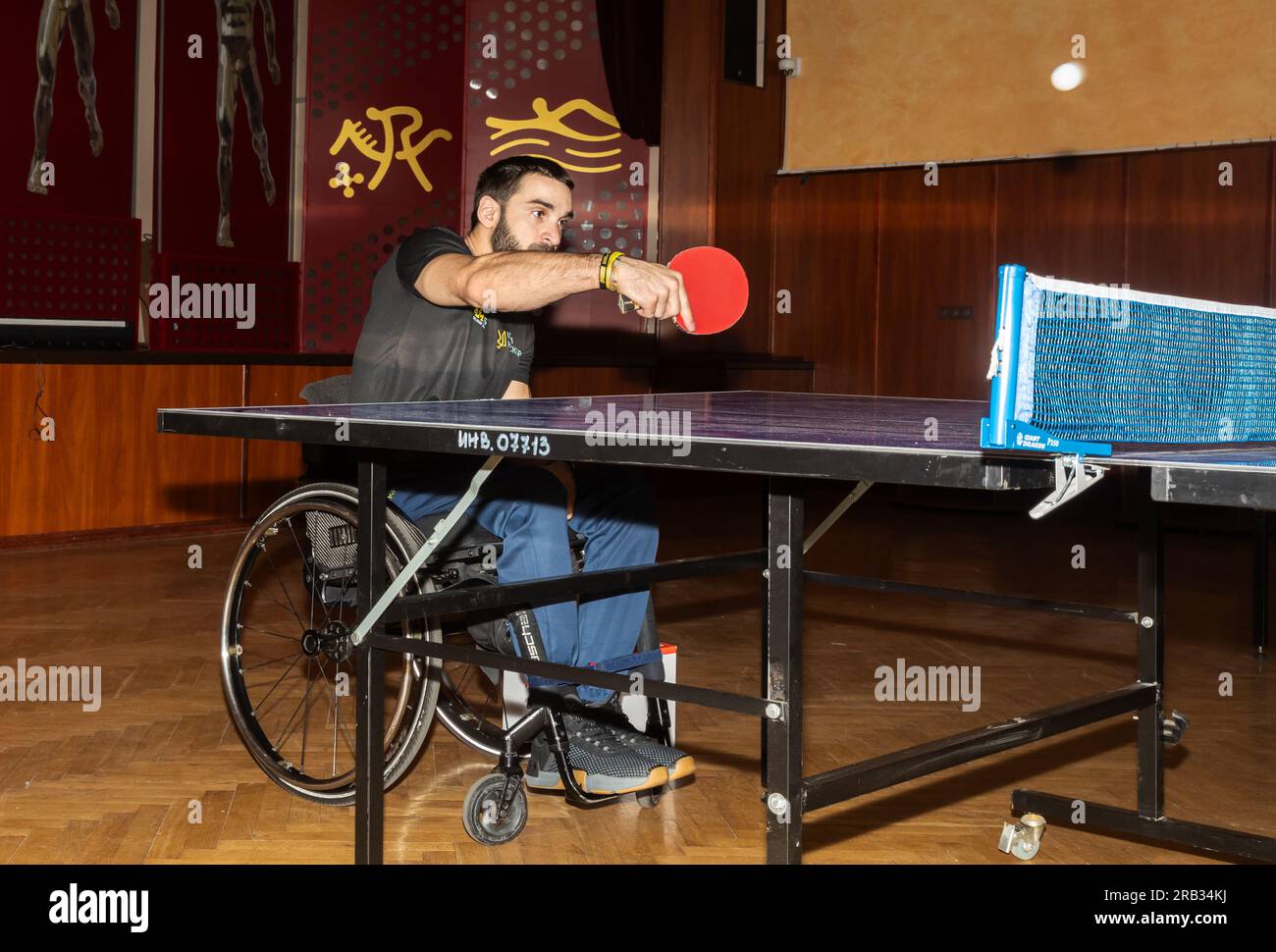KYIV, UKRAINE - Jul. 05, 2023: A man in a wheelchair is seen playing ...