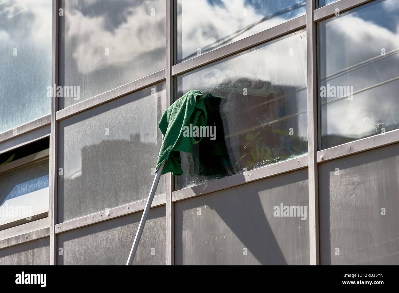 window washing, washing a street shop window Stock Photo - Alamy