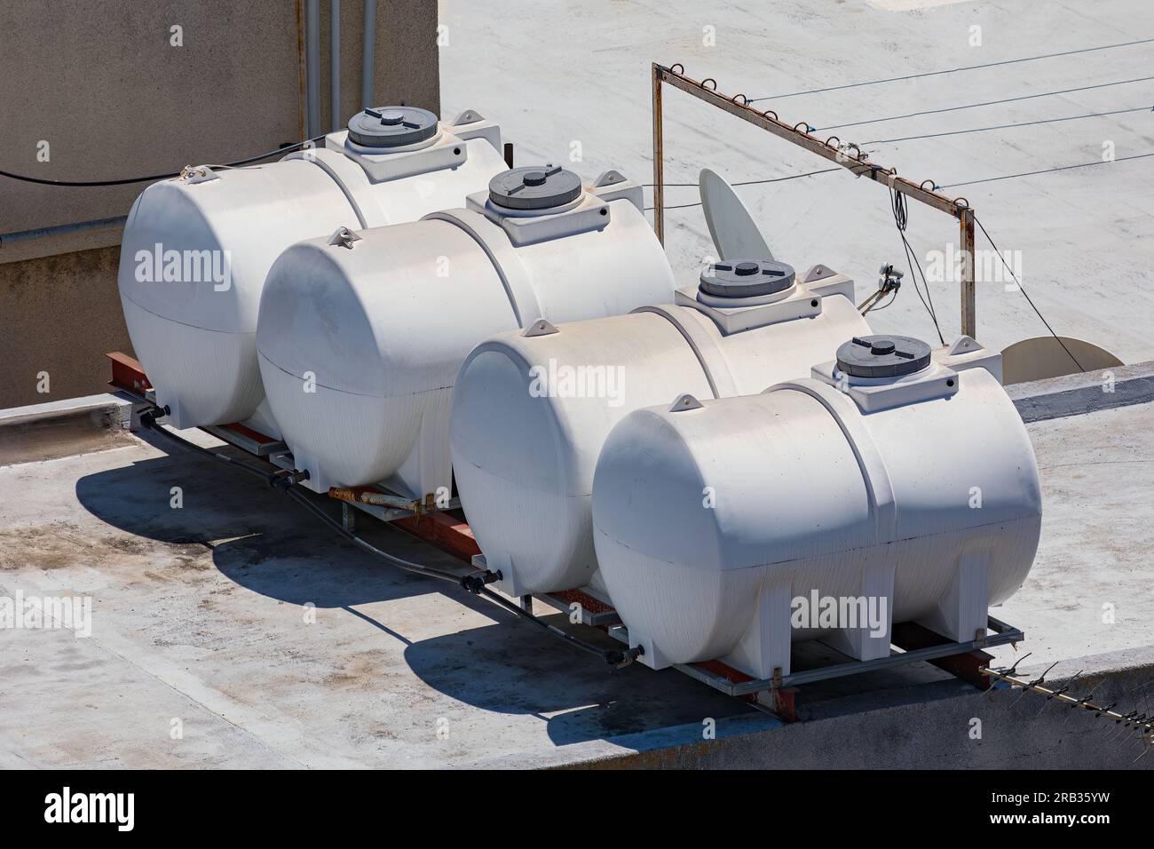 Water tanks on the roof of the building for storage of water for ...