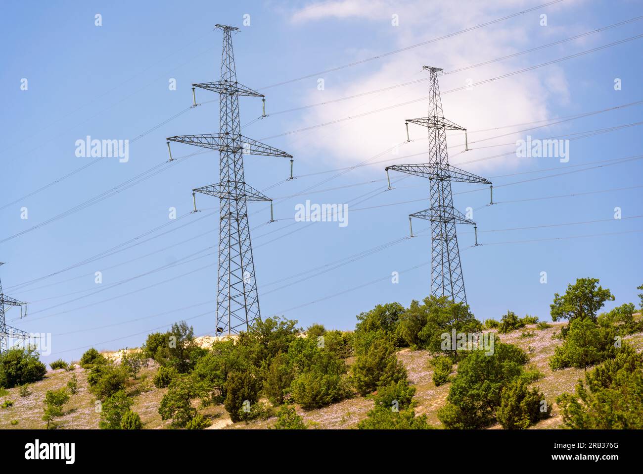 High voltage towers with sky background. Power line support with wires ...