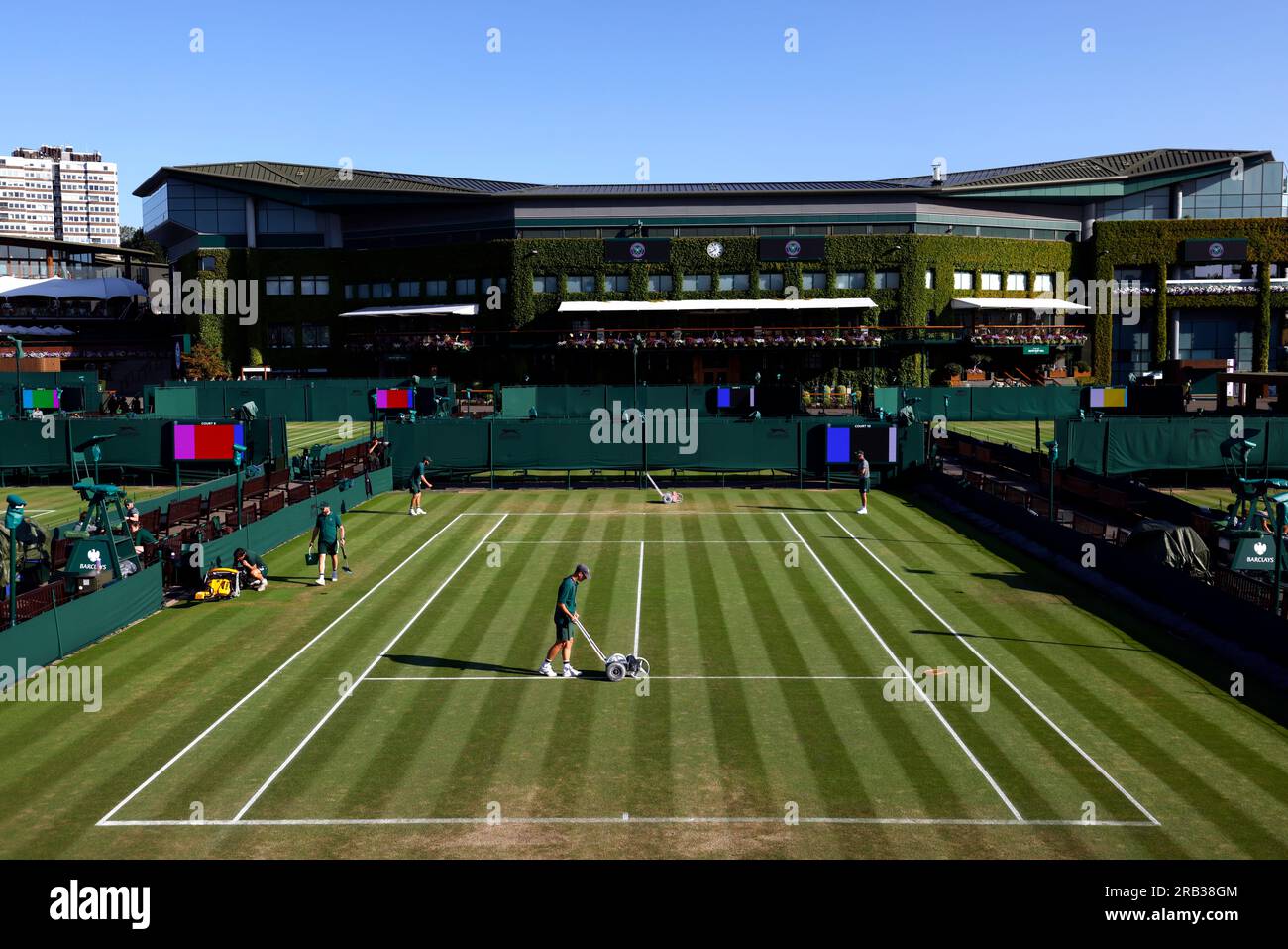 Court lines are painted on day five of the 2023 Wimbledon Championships ...