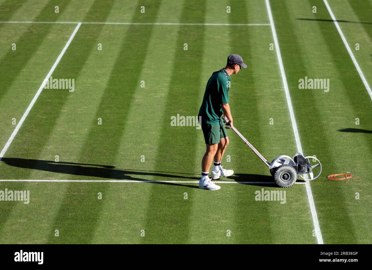 Court lines are painted on day five of the 2023 Wimbledon Championships ...
