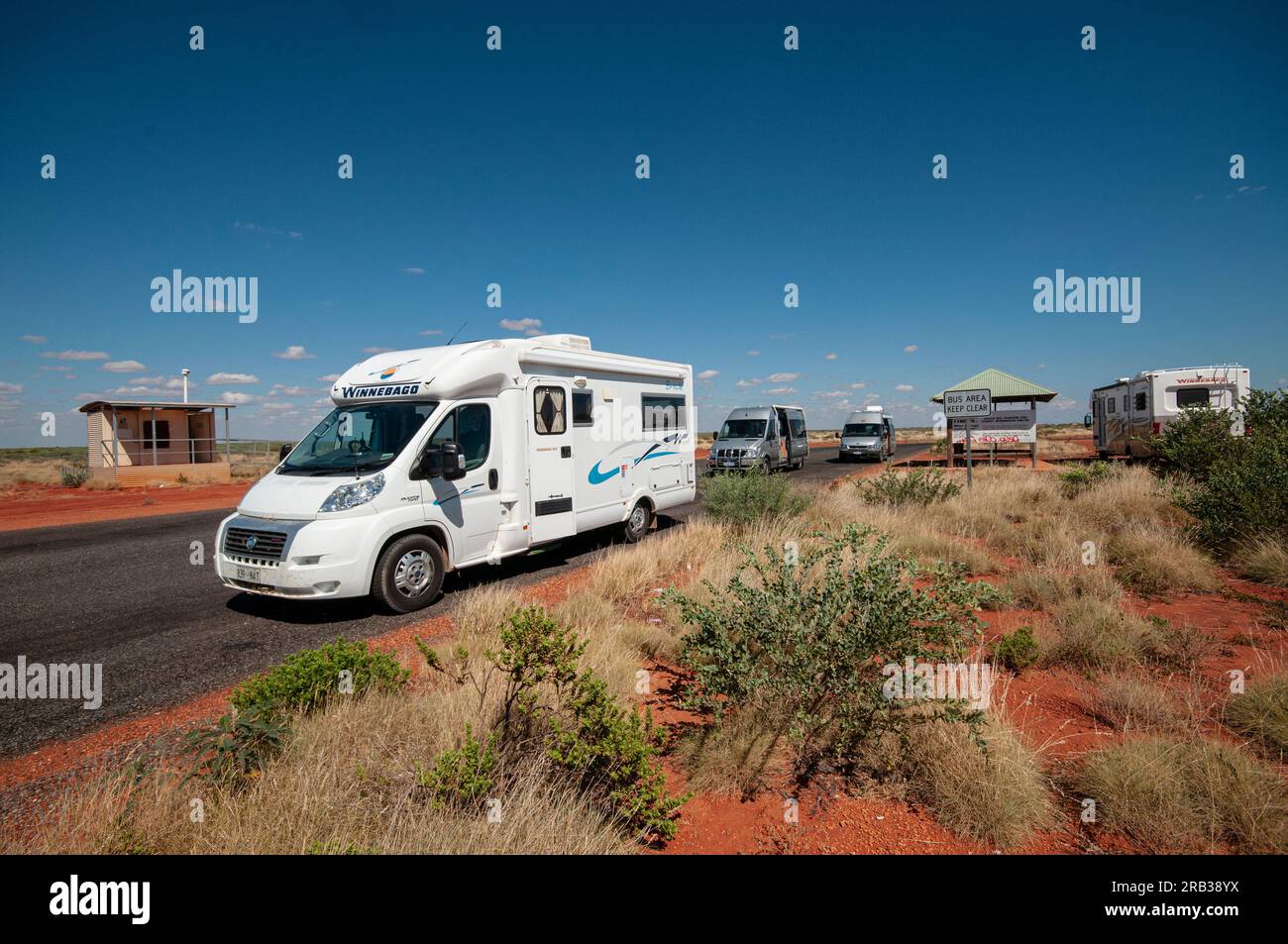 Caravans and motor homes pull up at a rest stop on the road crossing of ...